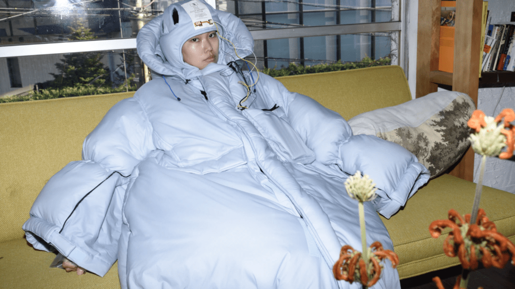 Japan creates high-tech puffer jacket for catching Z's on the move ...